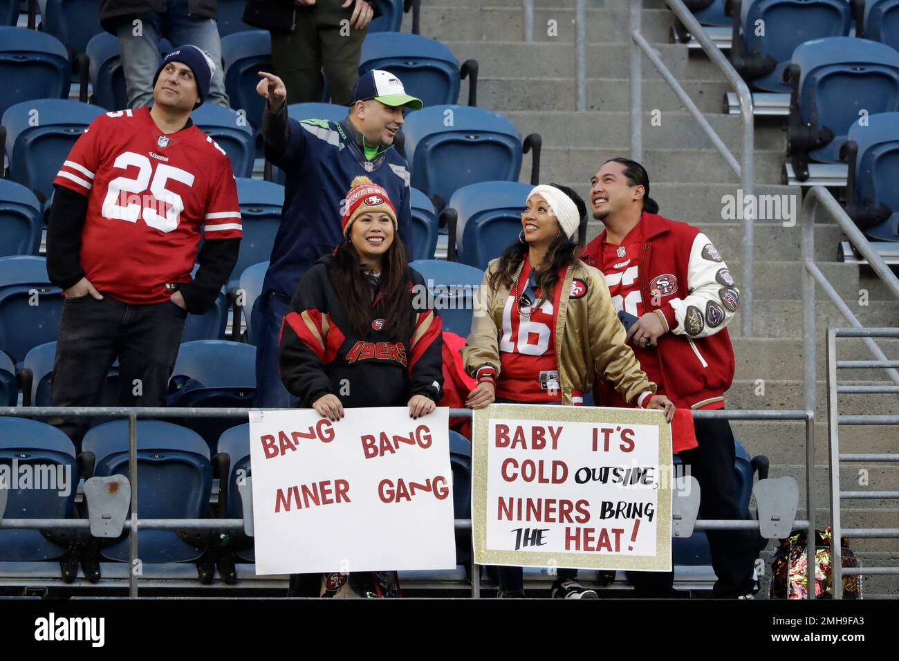 San Francisco 49ers fans chat with a Seattle Seahawks fan before an NFL ...