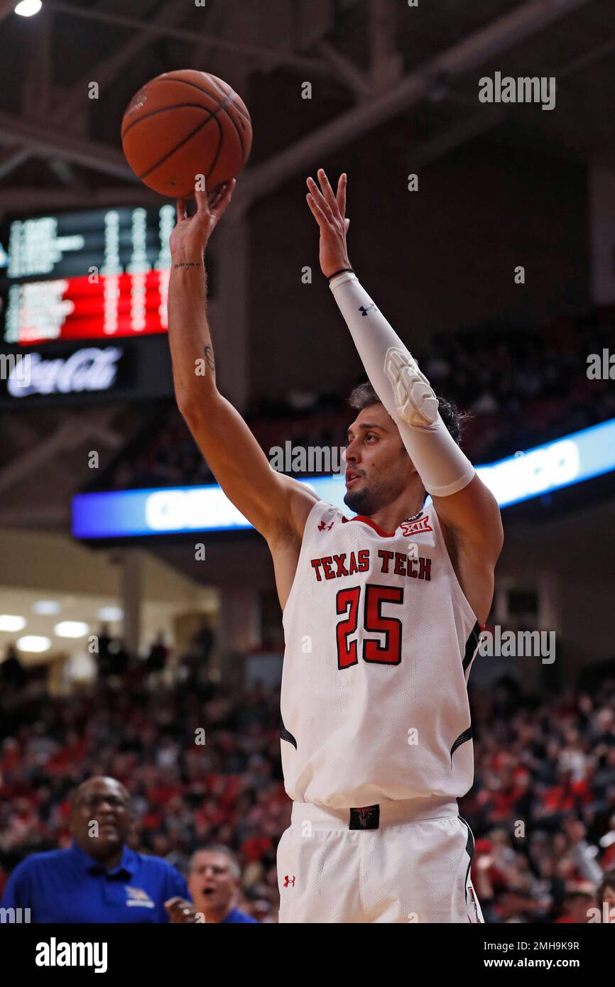 Texas Tech's Davide Moretti (25) shoots the ball for three points ...