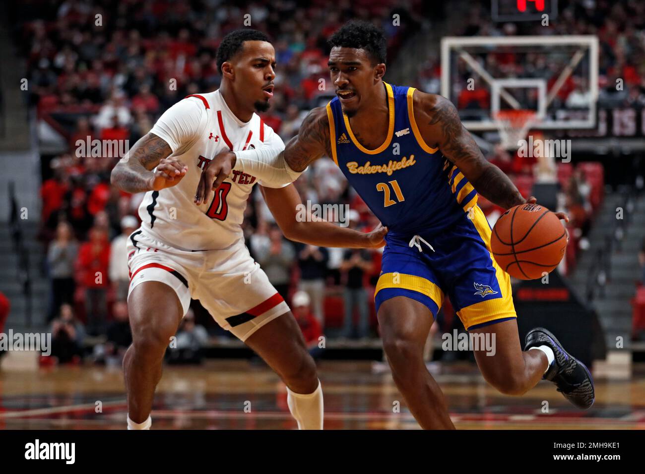 Cal State Bakersfield's Greg Lee (21) drives the ball around Texas Tech ...