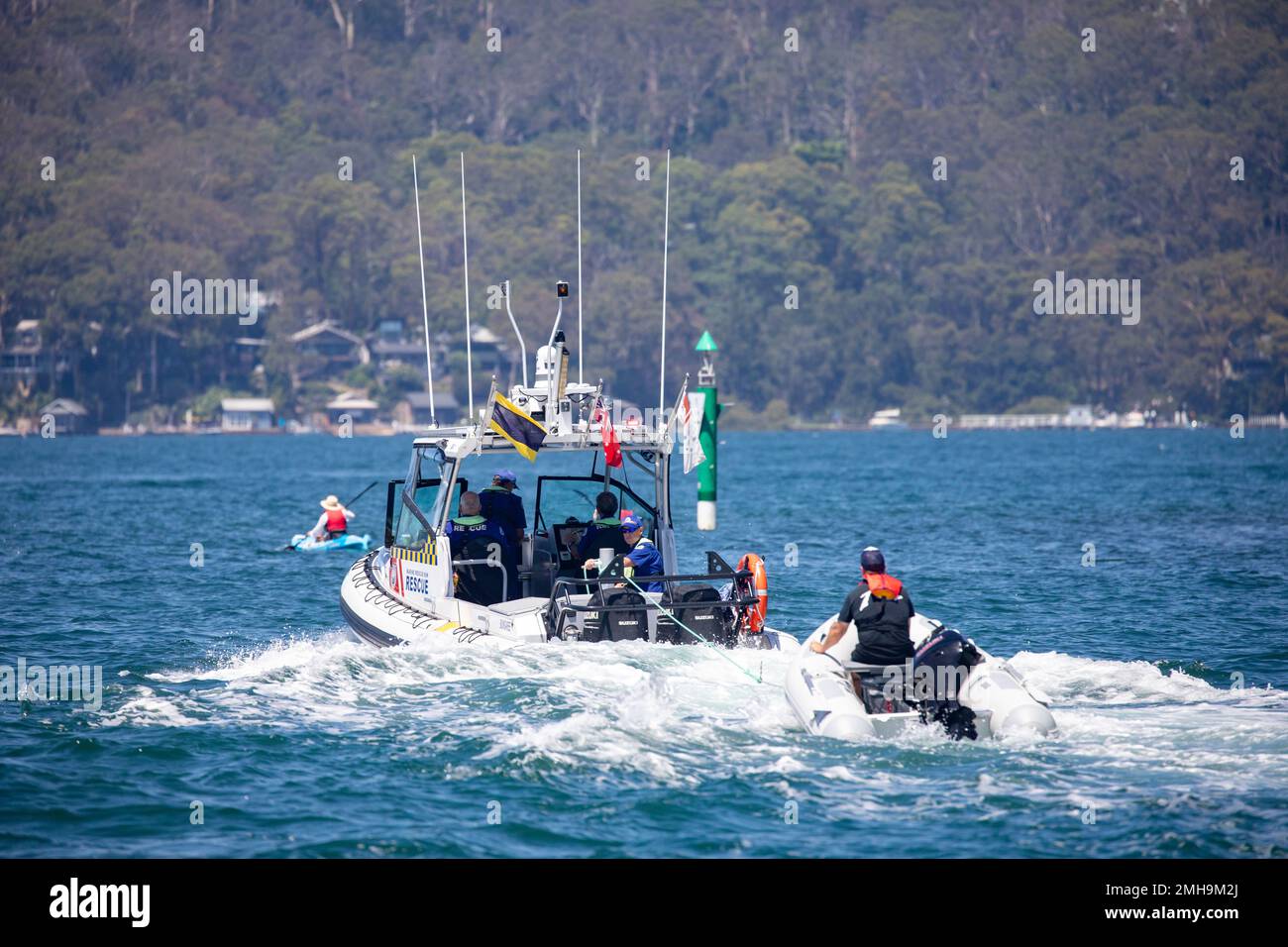 Marine Rescue NSW volunteer staff, rescue a small dinghy boat on ...
