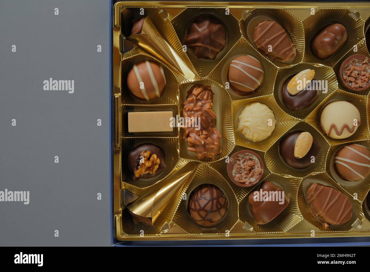chocolate candies on a gray background. Chocolate box.Milk chocolate ...