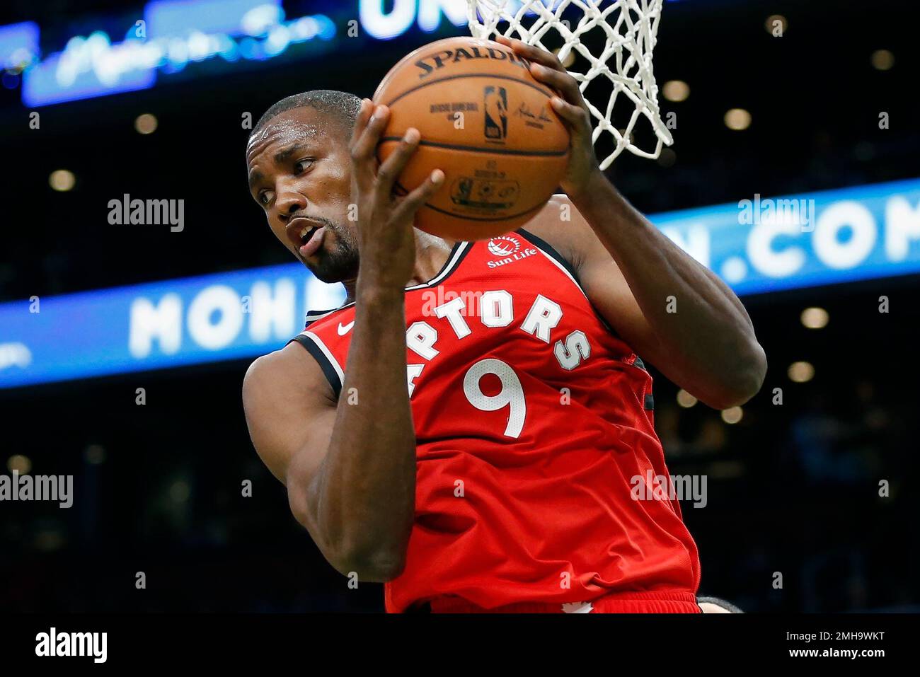 Toronto Raptors' Serge Ibaka grabs a rebound during the first half on ...