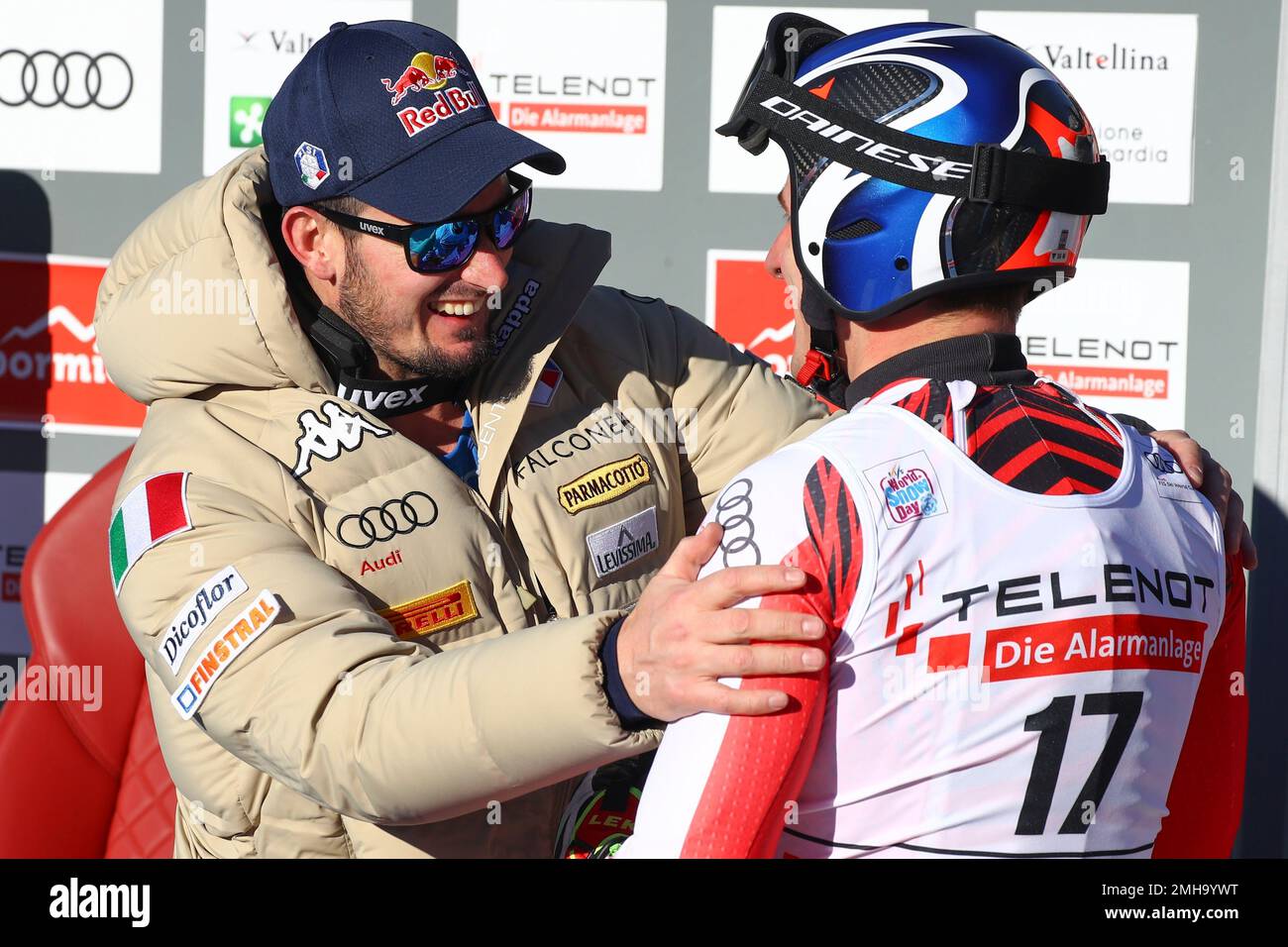 Italy's Dominik Paris, left, shares a word with Austria's Matthias ...