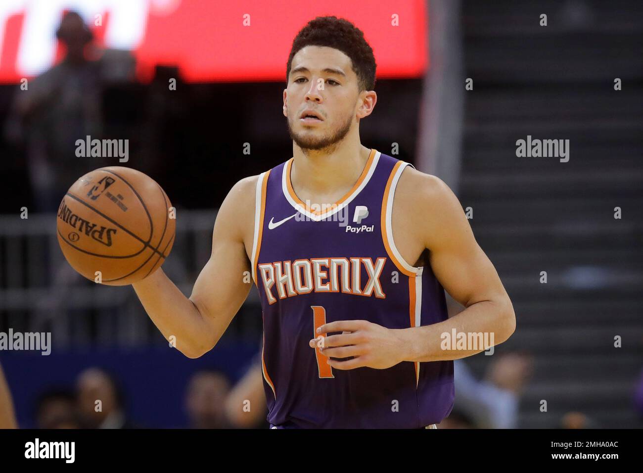 Phoenix Suns guard Devin Booker brings the ball up during the second ...