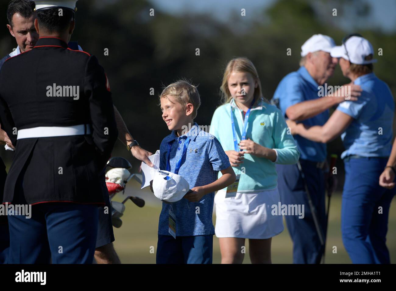 Annika Sorenstam's son, William Nicholas McGee, center, and daughter, Ava McGee, leave the 18th ...