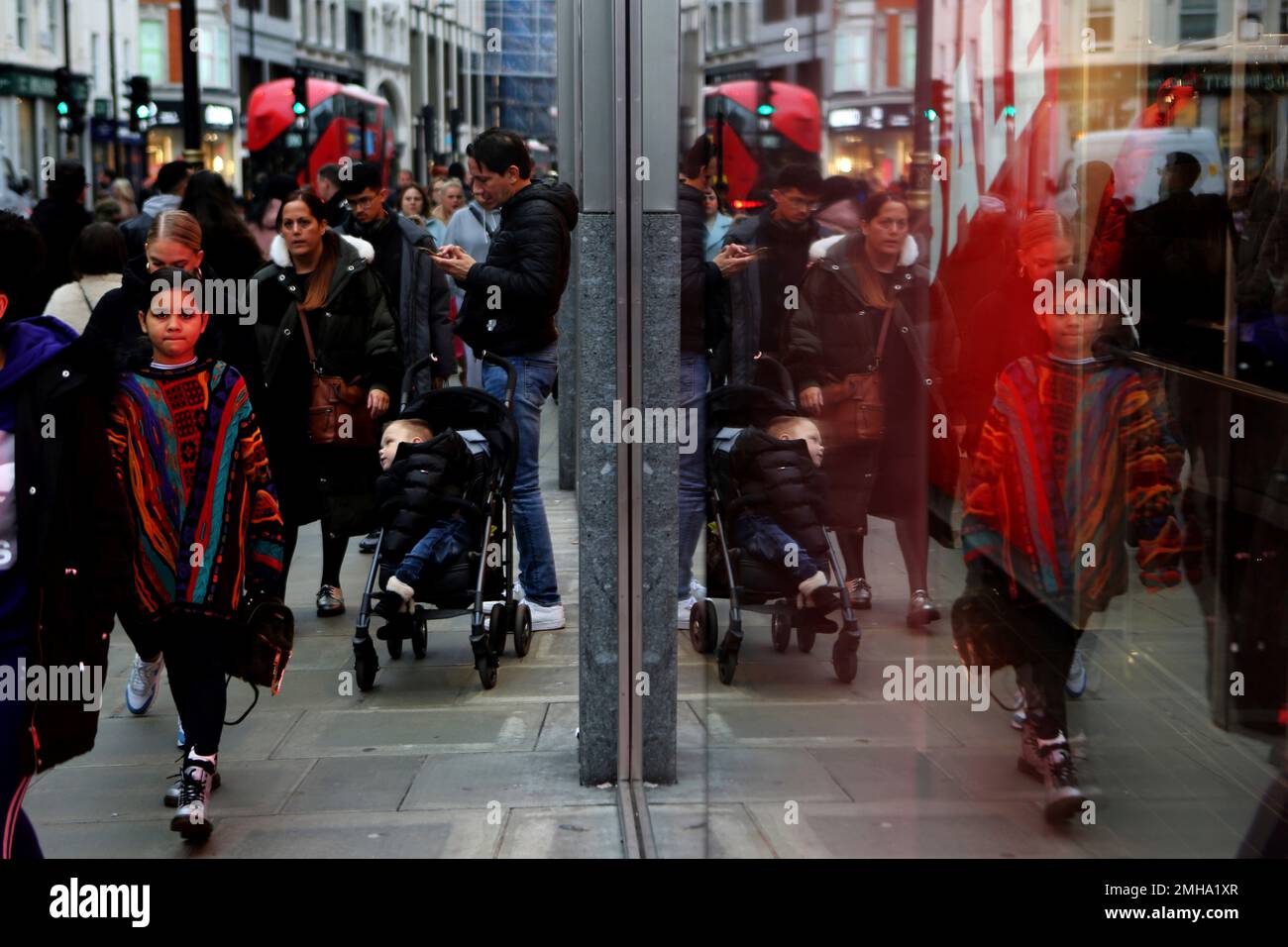 People walk past a shop in central London, England, Friday, Dec. 27 ...