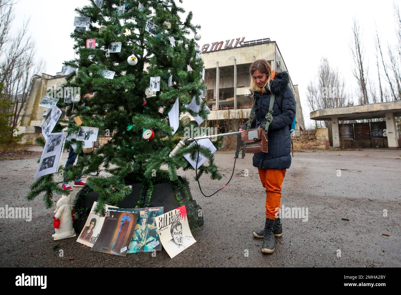 In this Wednesday, Dec. 25, 2019 photo, a former resident checks the ...