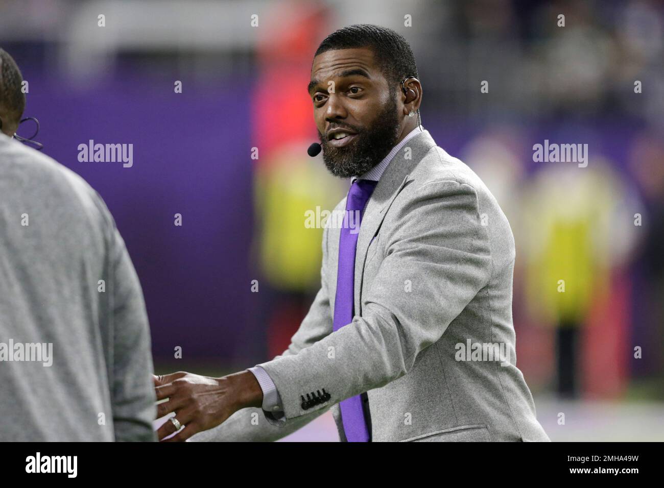 ESPN Monday Night Countdown personality Randy Moss stands on the field ...