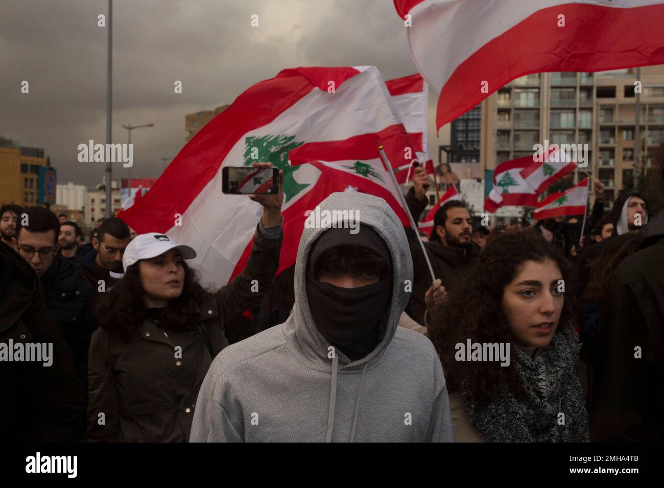Lebanese expatriates carry national flags and chant anti-government ...