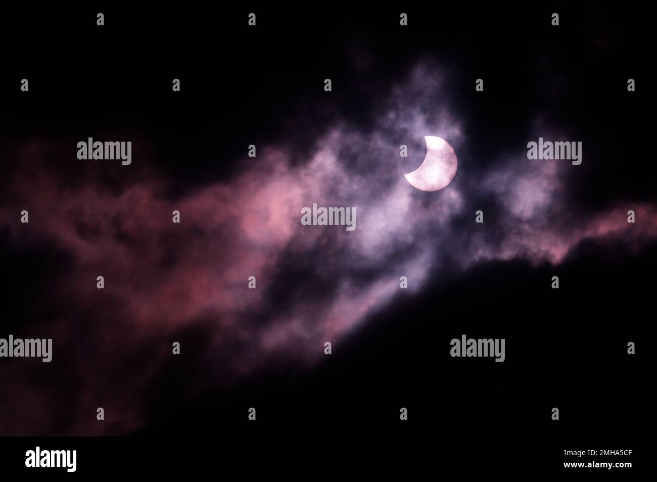 A partial solar eclipse is seen in Quezon city, metropolitan Manila ...