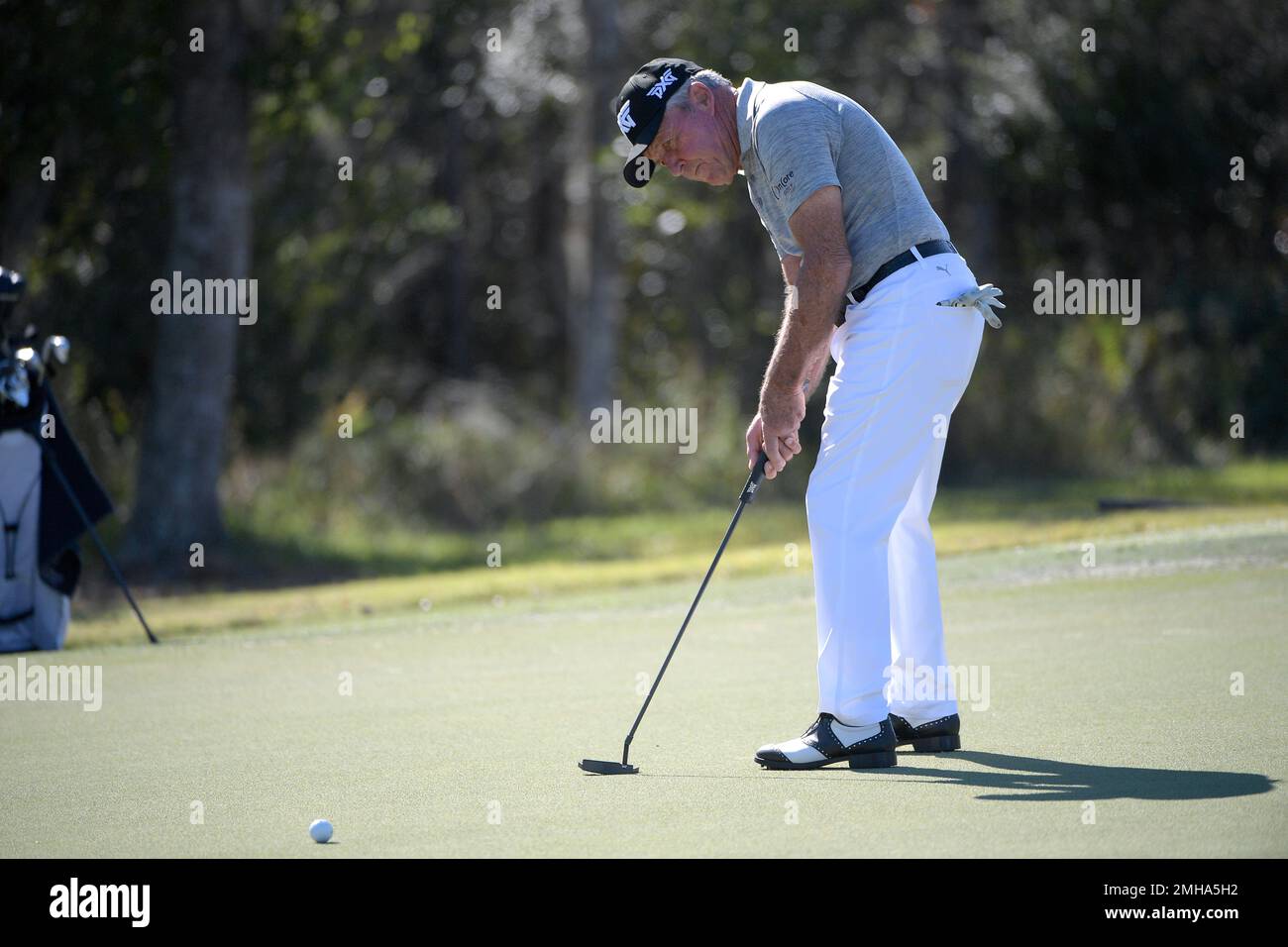 Gary Player watches his putt on the seventh green during the first ...