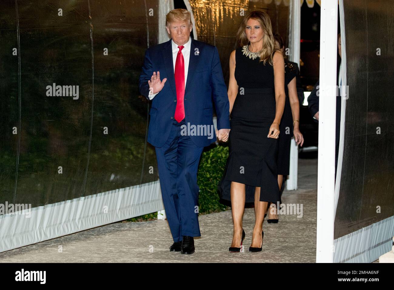 President Donald Trump and first lady Melania Trump arrive for ...