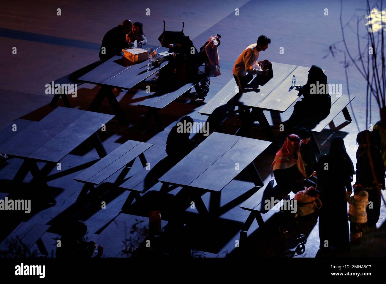 In this Dec. 13, 2019 photo, visitors prepare to eat at the family ...