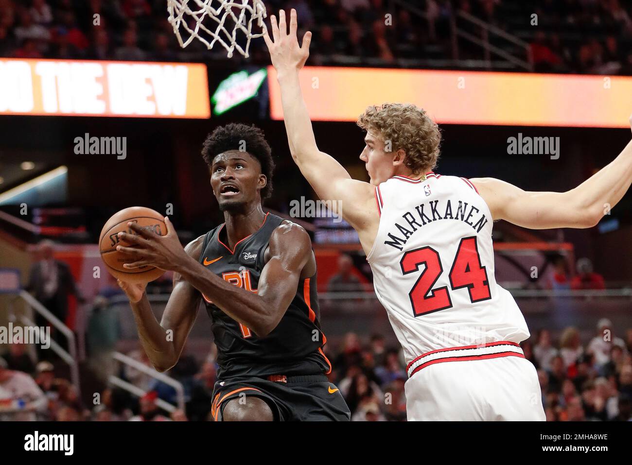 Orlando Magic forward Jonathan Isaac, left, makes a shot against ...
