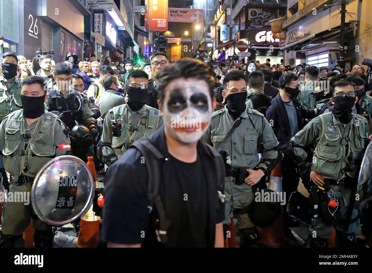 In this Thursday, Oct. 31, 2019, photo, a man with his face painted ...