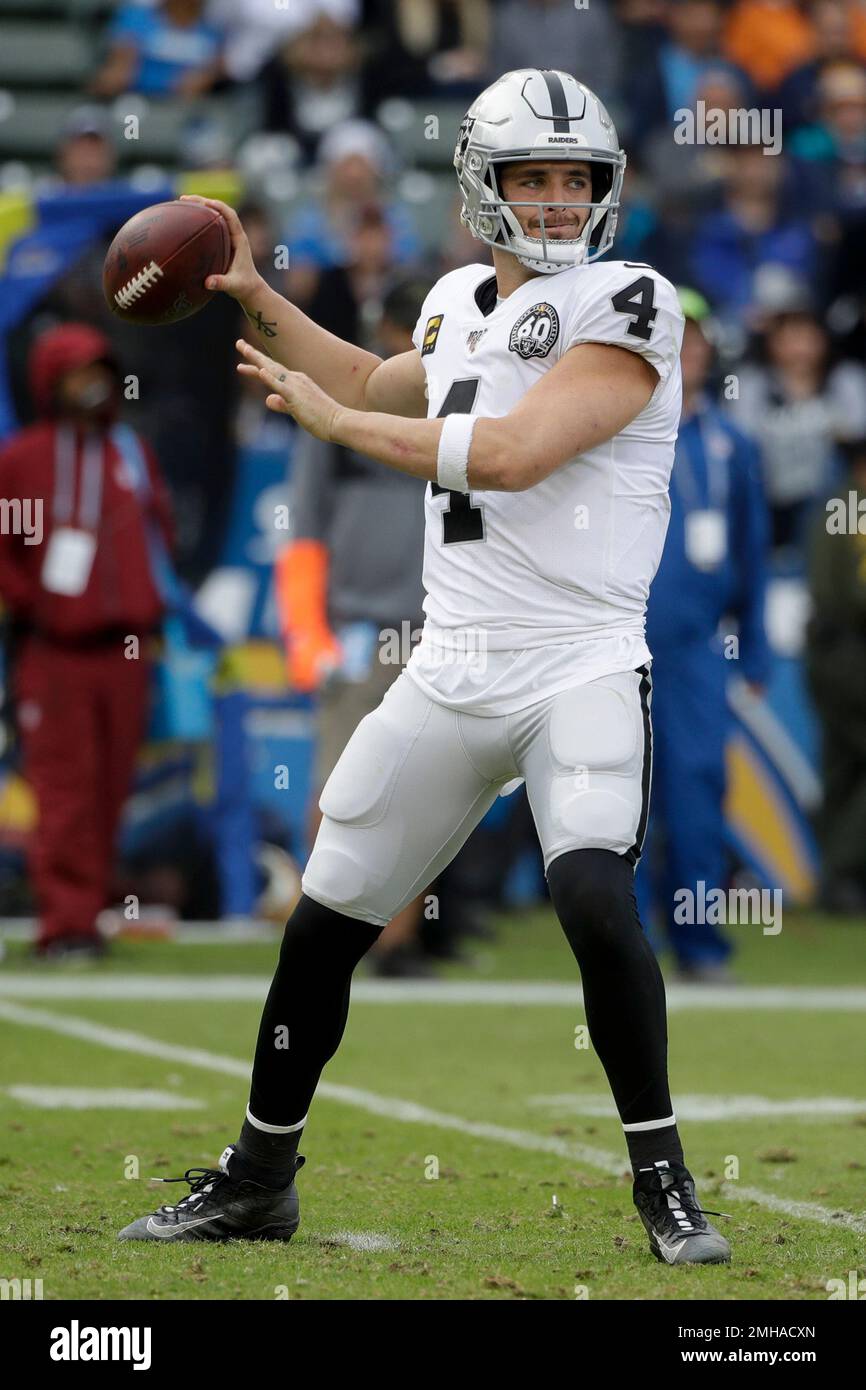 Oakland Raiders quarterback Derek Carr passes against the Los Angeles ...