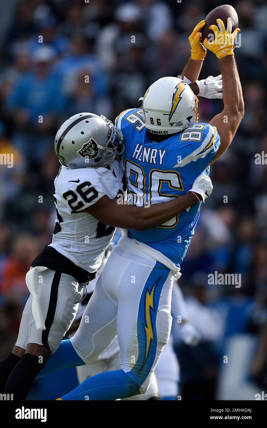 Oakland Raiders cornerback Nevin Lawson breaks up a pass intended for ...