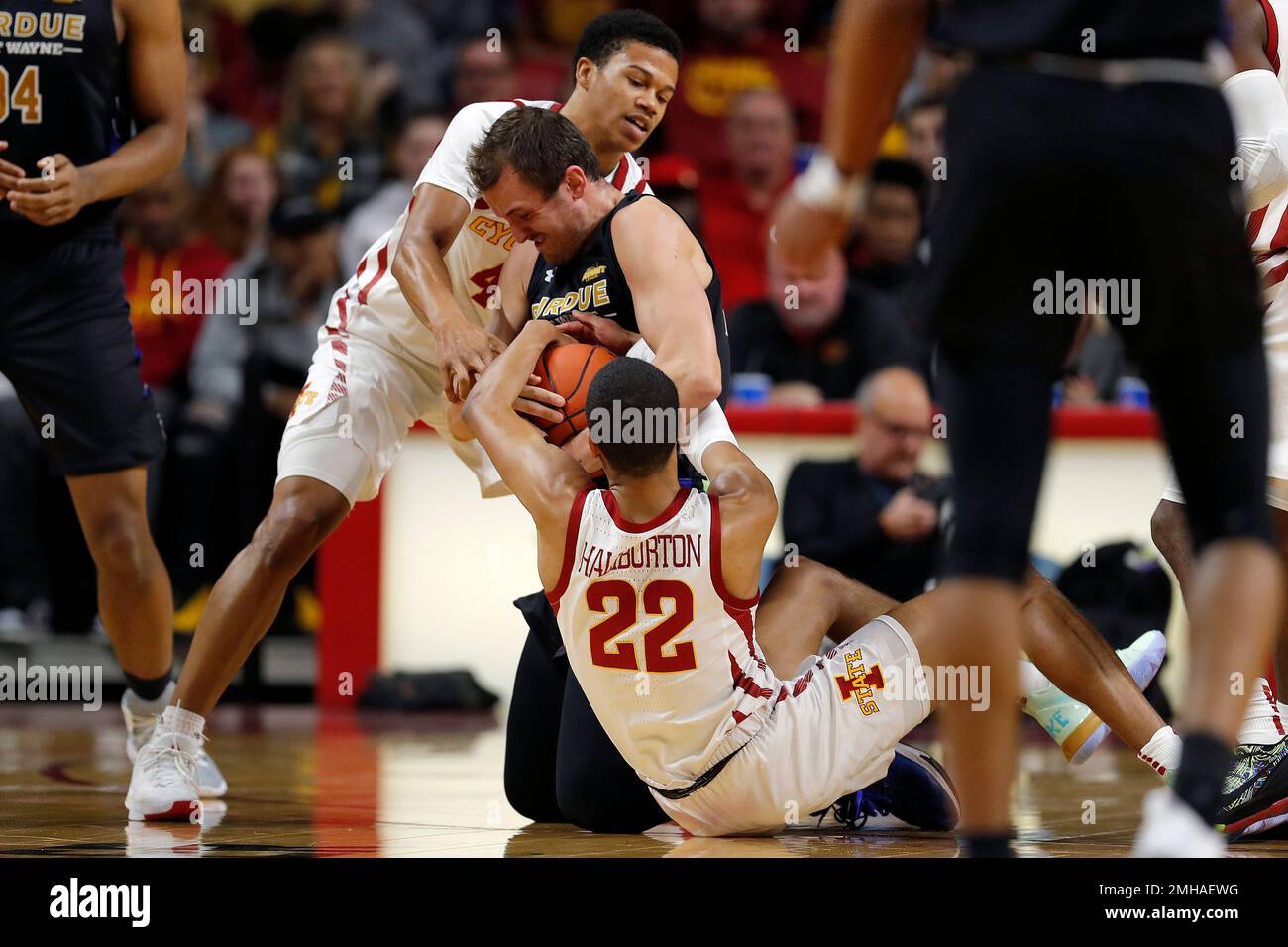 Iowa State guards Rasir Bolton, top, and Tyrese Haliburton, bottom, try ...