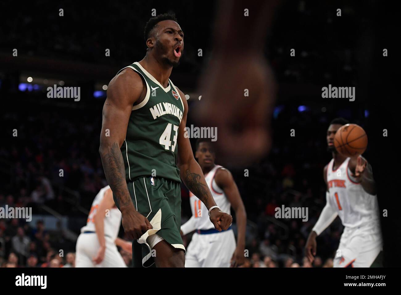 Milwaukee Bucks forward Thanasis Antetokounmpo (43) reacts after making ...