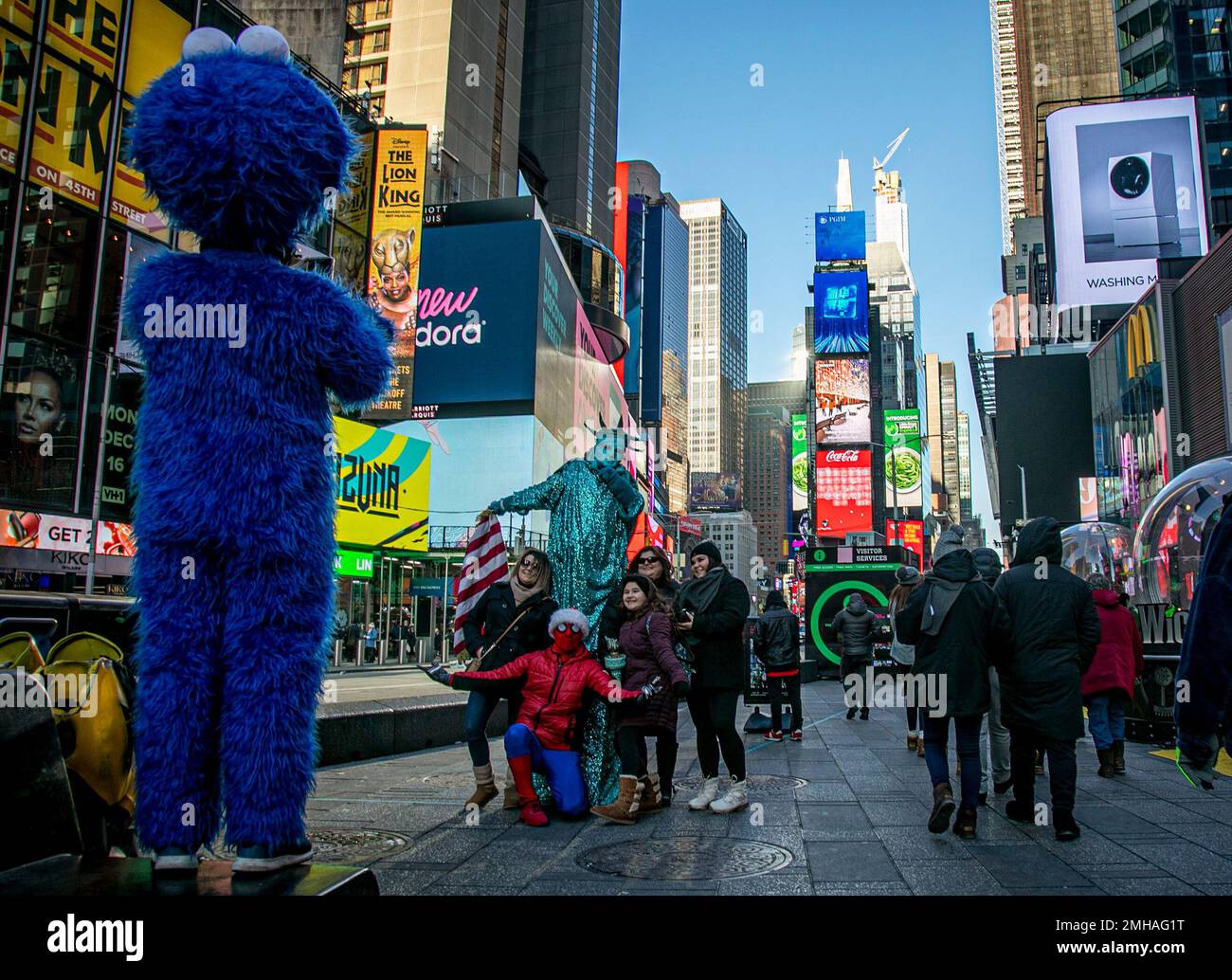 In this Thursday, Dec. 19, 2019 photo, people snap pictures with ...