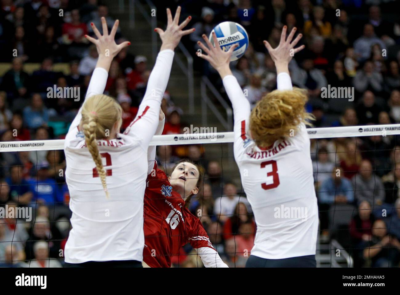 Wisconsin's Dana Rettke (16) this a spike blocked by Stanford's Holly ...