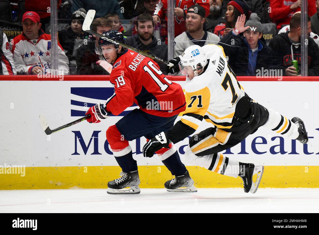 Pittsburgh Penguins center Evgeni Malkin (71) falls to the ice next to ...