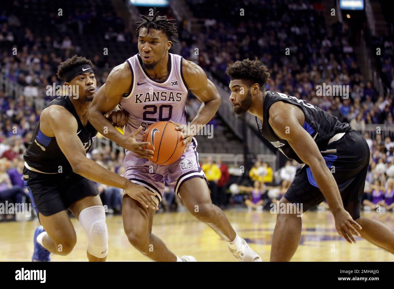 Kansas State's Xavier Sneed (20) is pressured by Saint Louis' Jordan ...