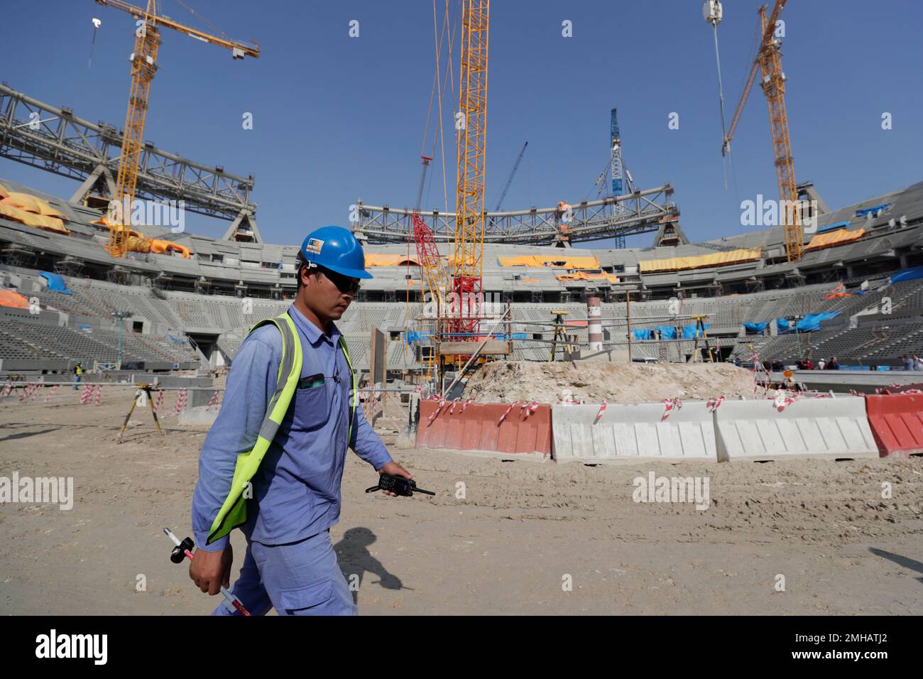 Workers work at Lusail Stadium, one of the 2022 World Cup stadiums, in ...