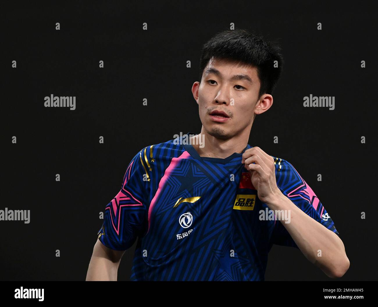 Doha, Qatar. 26th Jan, 2023. Zhou Kai of China reacts during the men's singles final match ...