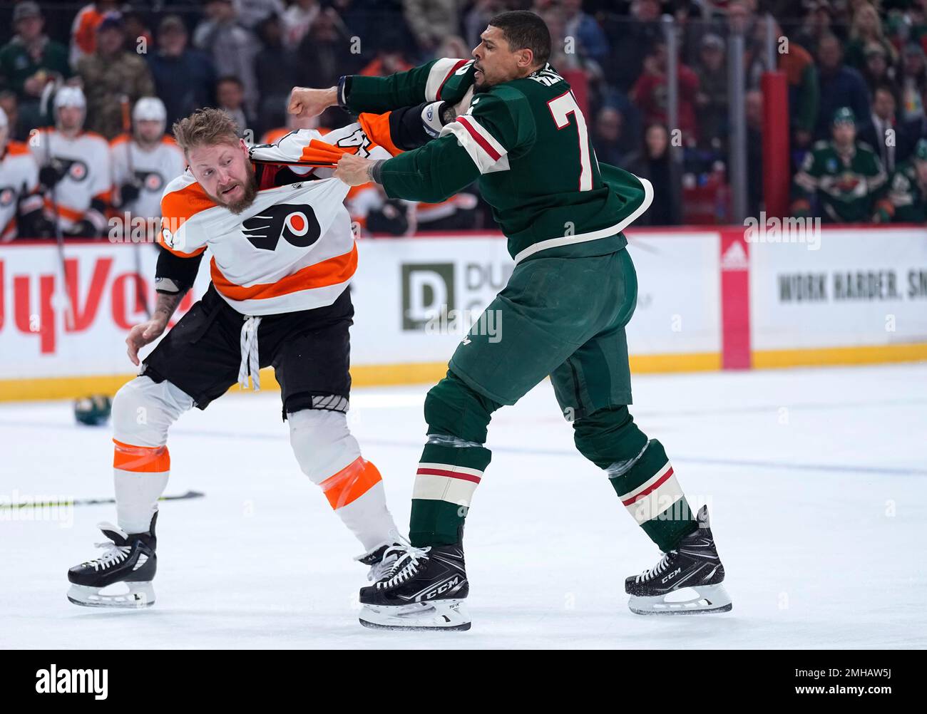 Philadelphia Flyers left wing Nicolas Deslauriers, left, and Minnesota ...