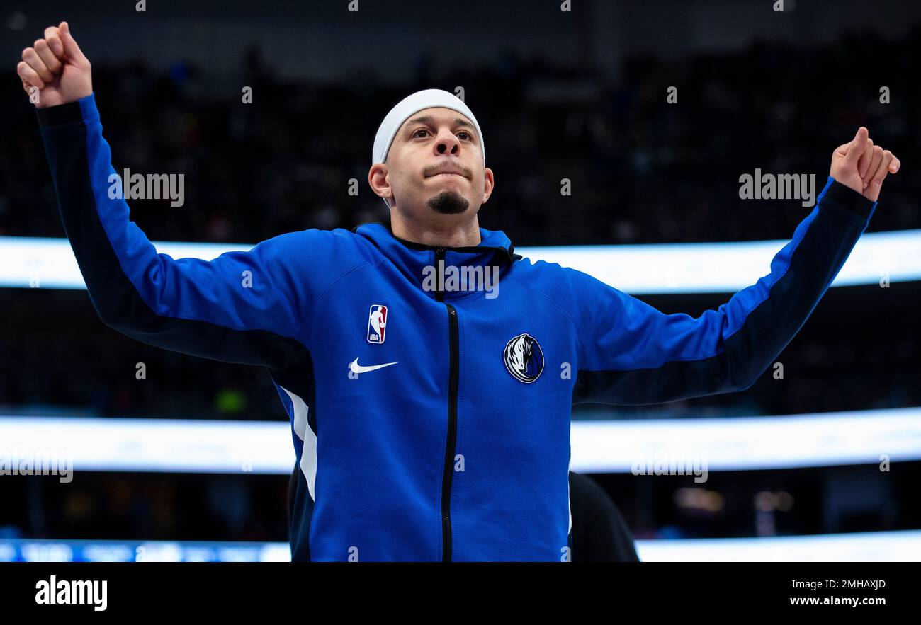 Dallas Mavericks guard Seth Curry stretches before an NBA basketball ...