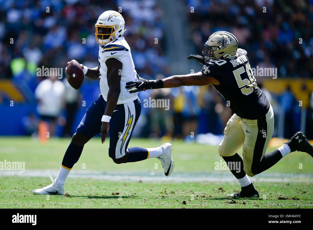 Los Angeles Chargers quarterback Cardale Jones, left, runs past New ...