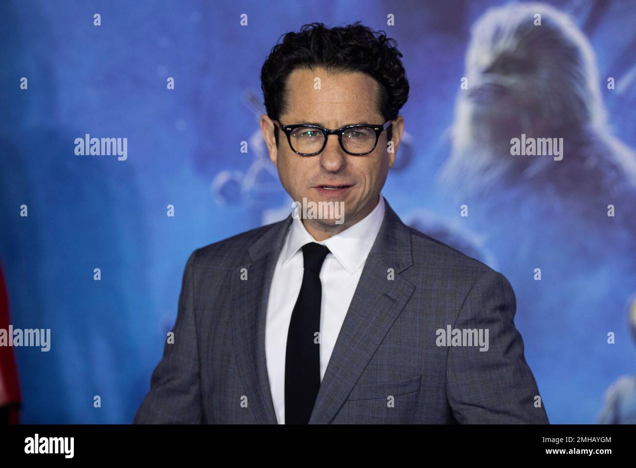 J. J. Abrams poses for photographers upon arrival at the premiere for ...