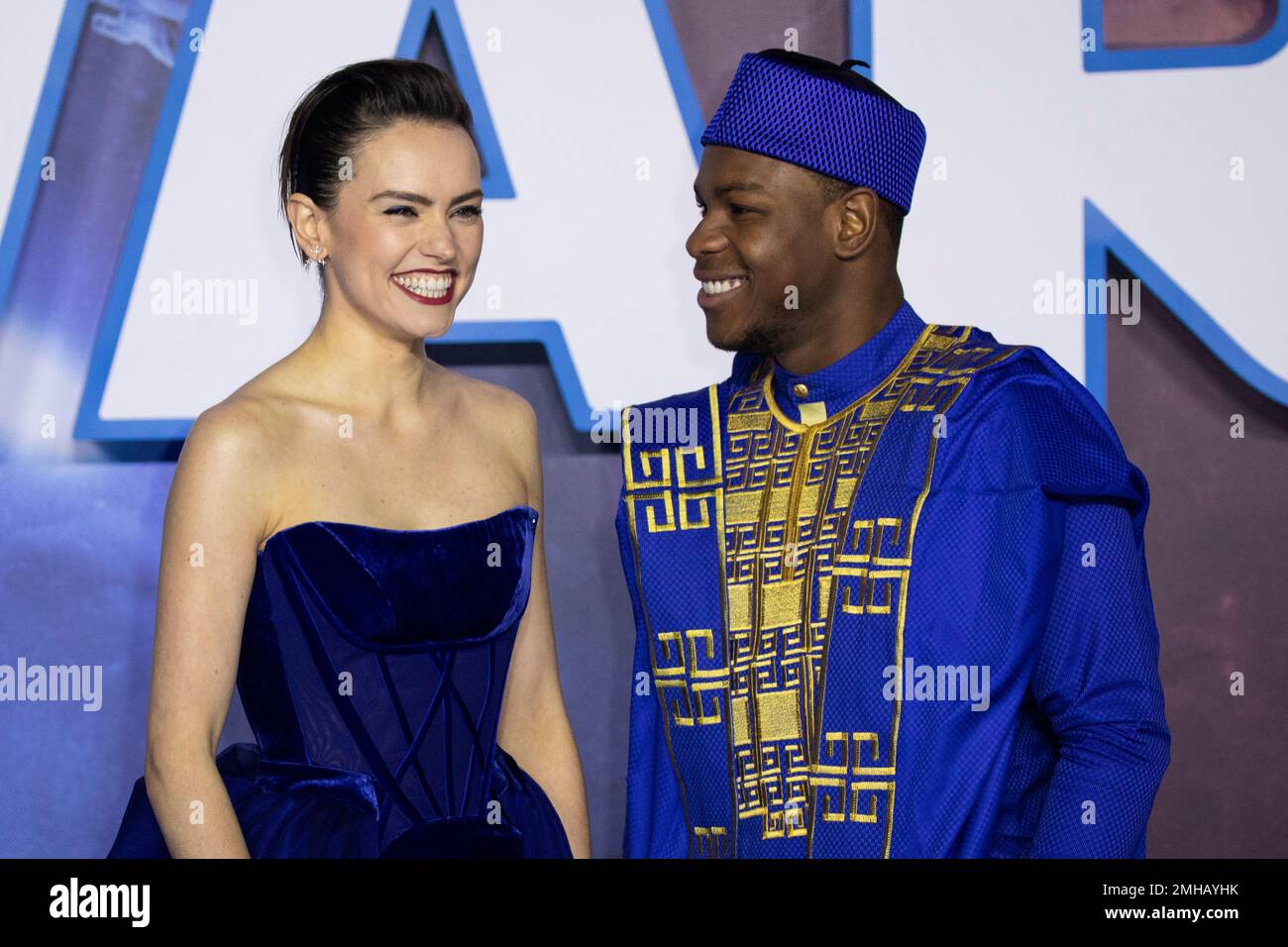 Actors Daisy Ridley and John Boyega pose for photographers upon arrival ...