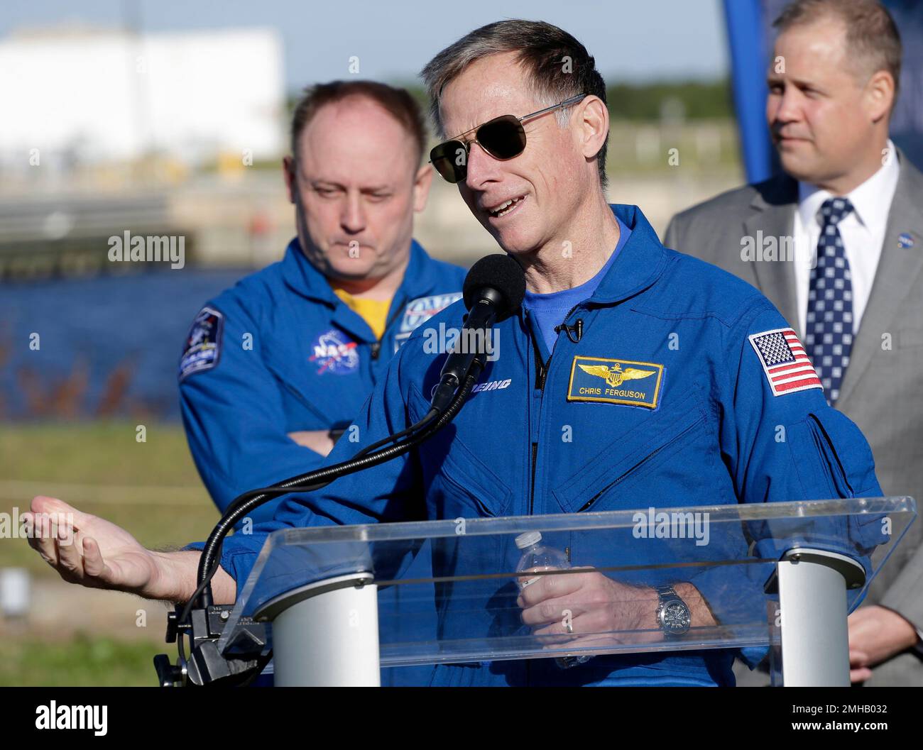 Boeing astronaut Chris Ferguson, center, speaks as NASA astronaut Mike ...