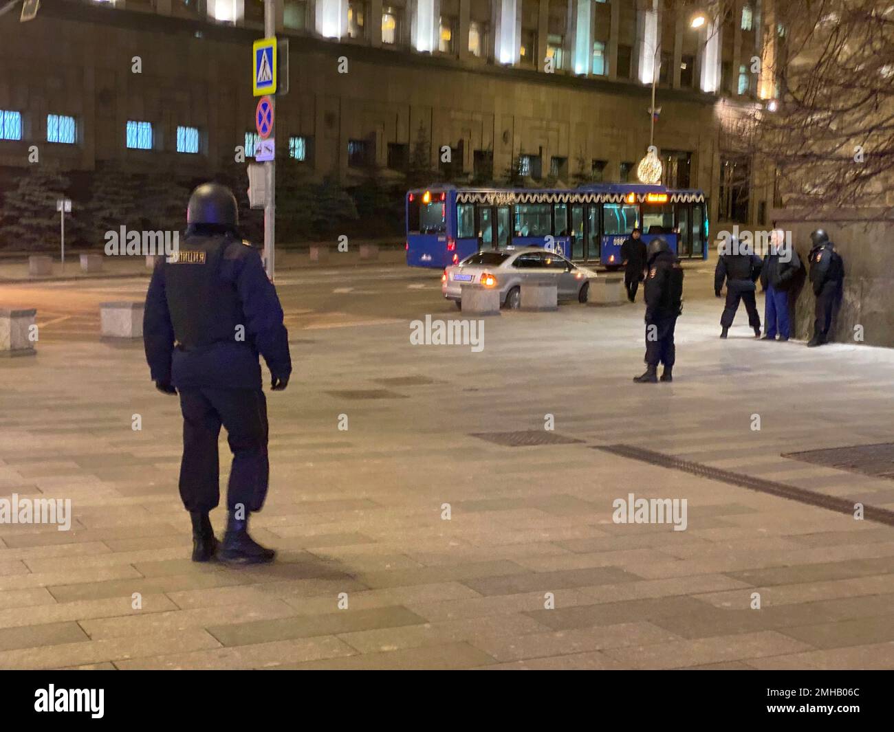 Russian police officers secure the area near the building of the ...