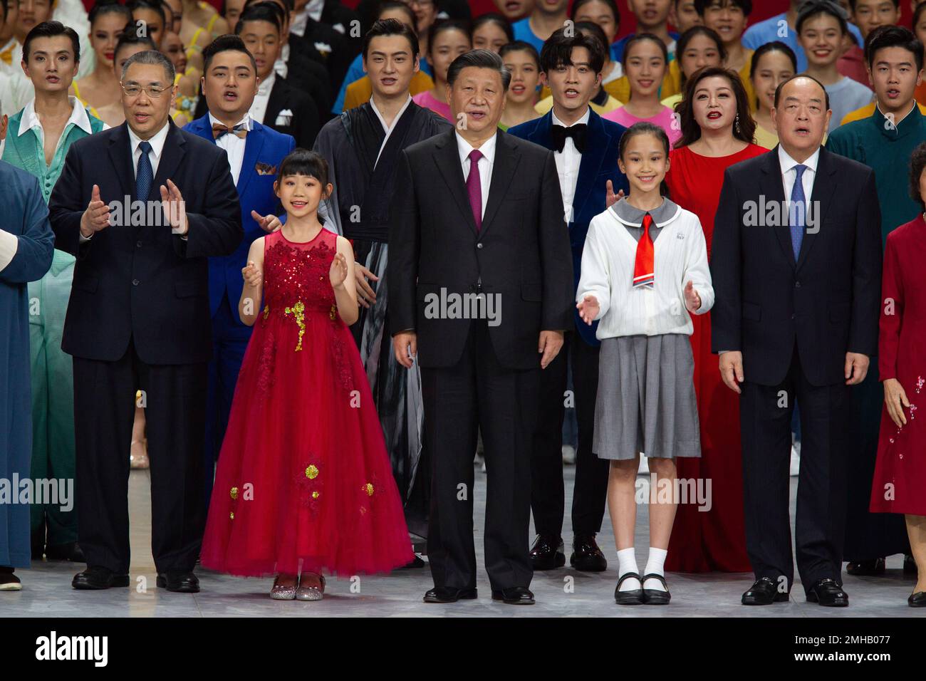 Chinese President Xi Jinping, center, outgoing Macao Chief Executive ...