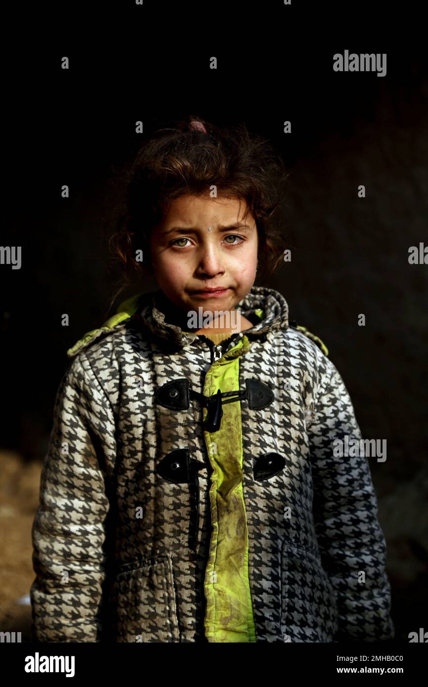 An Afghan girl poses for a photograph on the outskirts of Kabul ...