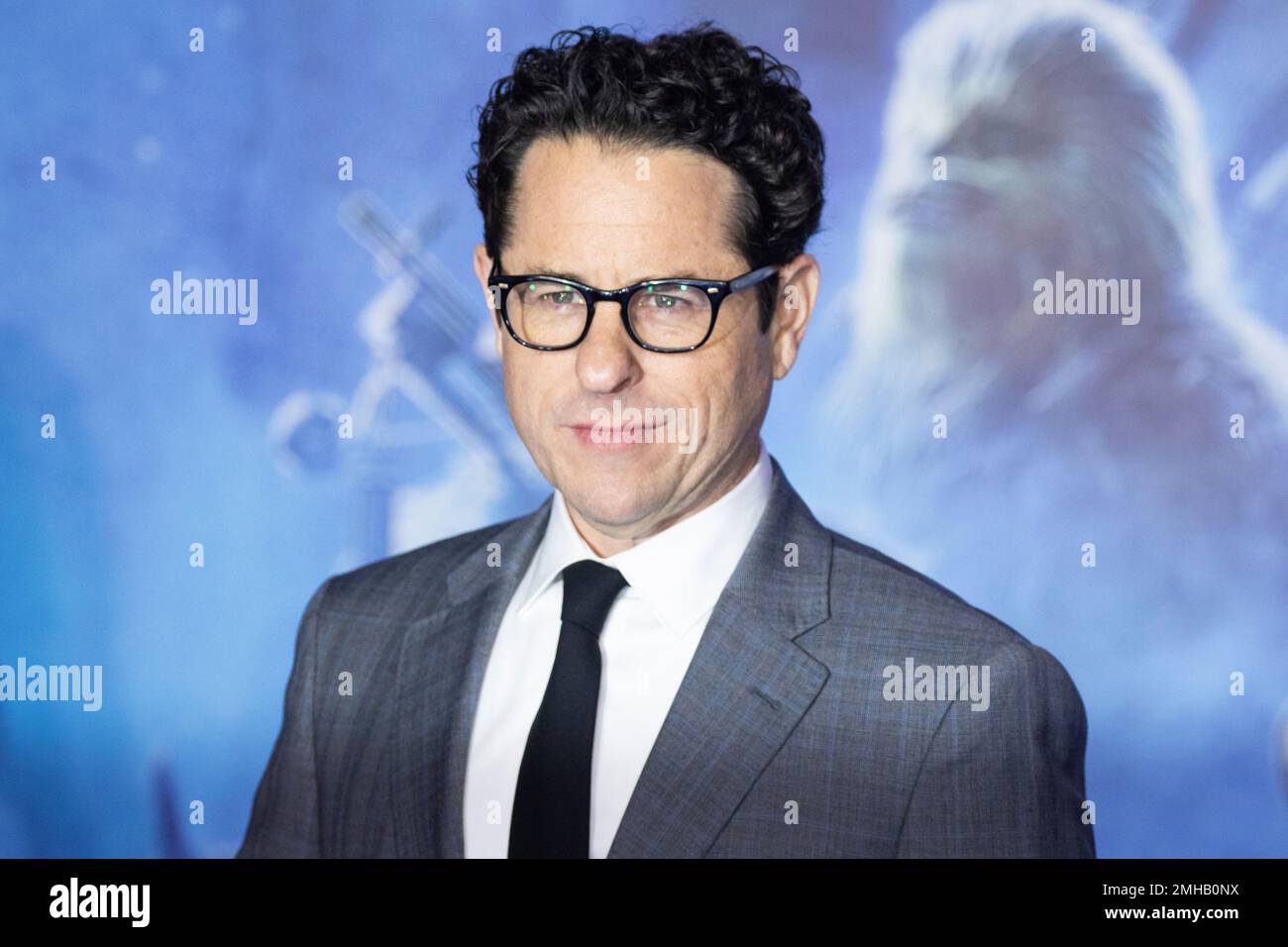 J. J. Abrams poses for photographers upon arrival at the premiere for ...
