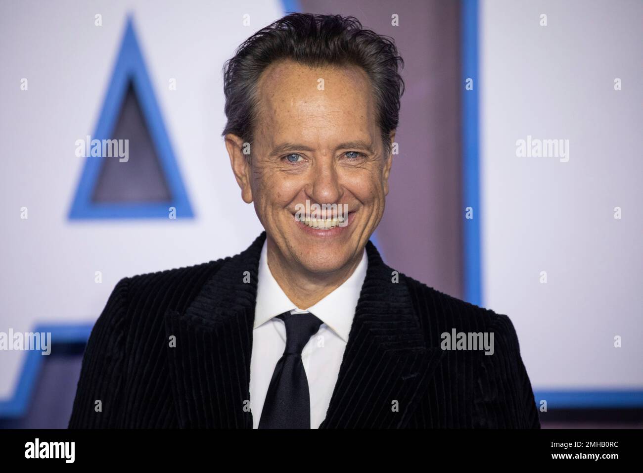 Richard E. Grant poses for photographers upon arrival at the premiere ...