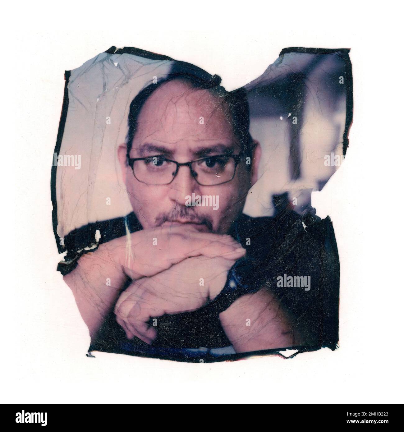 In this photo made from a Polaroid emulsion transfer, Jacob Olivas, 50 ...