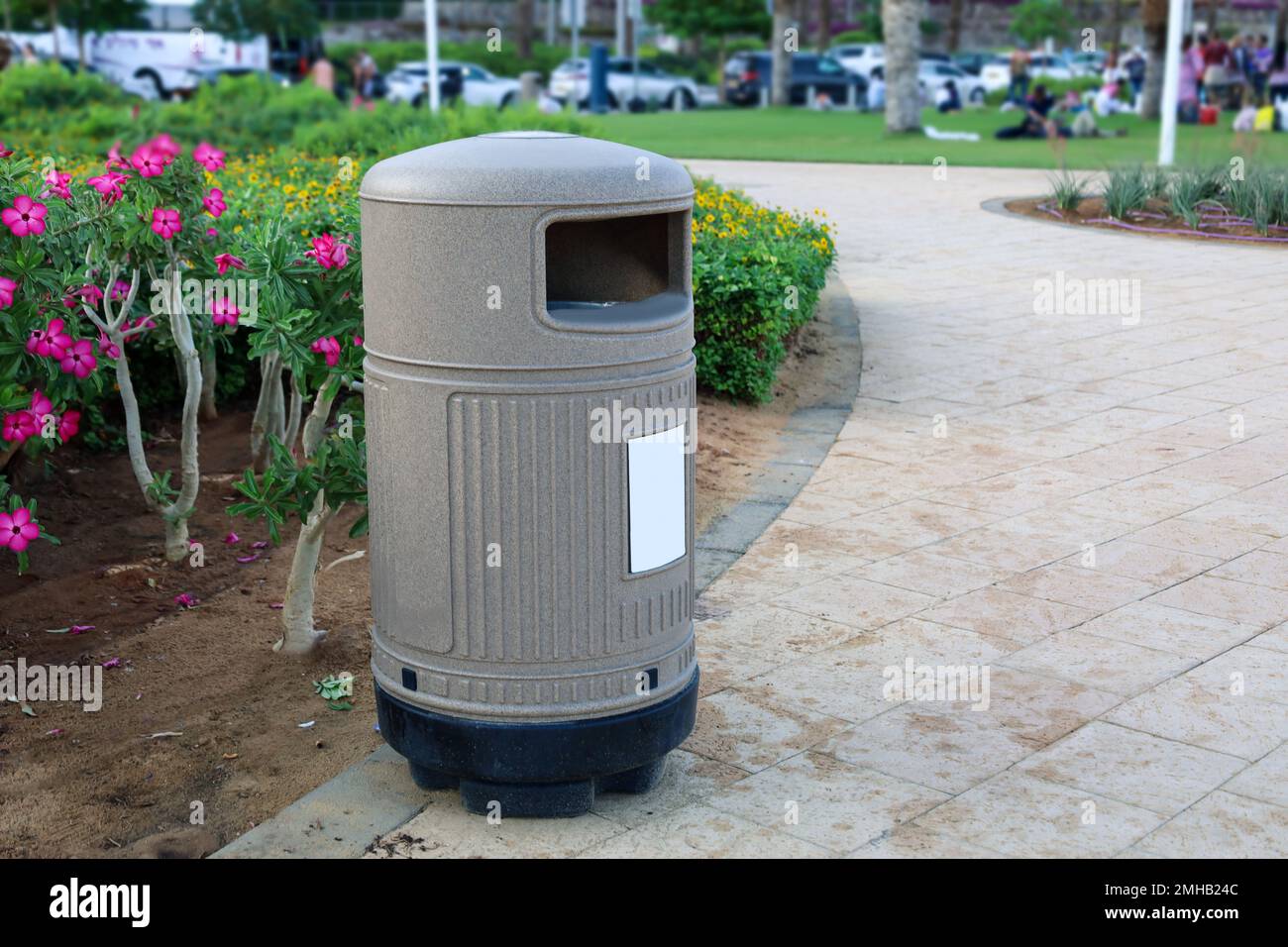 View of trash bin on city street Stock Photo - Alamy