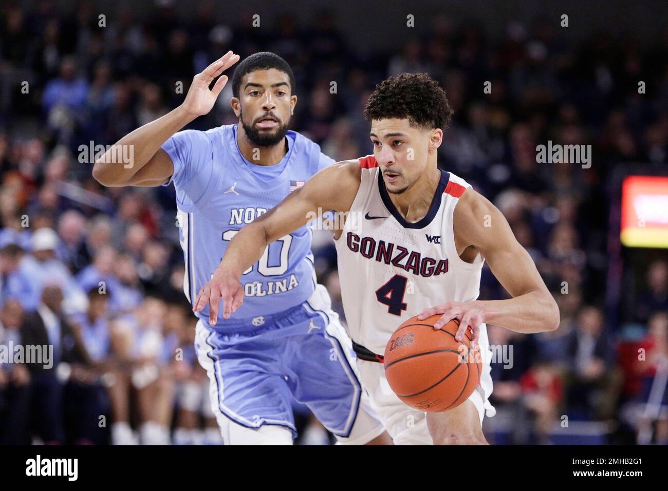 Gonzaga guard Ryan Woolridge, right, drives against North Carolina ...