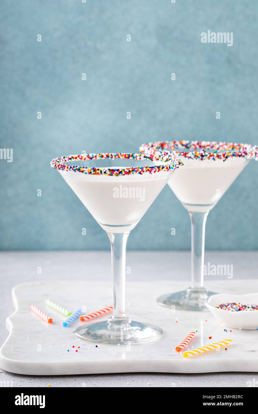 Birthday cake martini with sprinkles on rim Stock Photo - Alamy