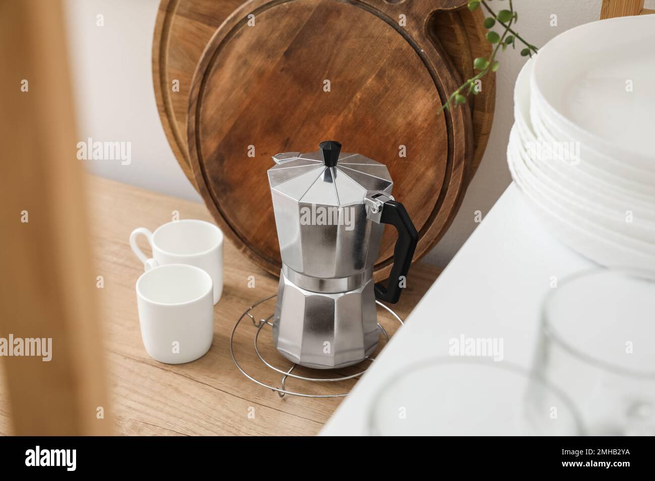 Geyser coffee maker and cups on counter in kitchen Stock Photo - Alamy