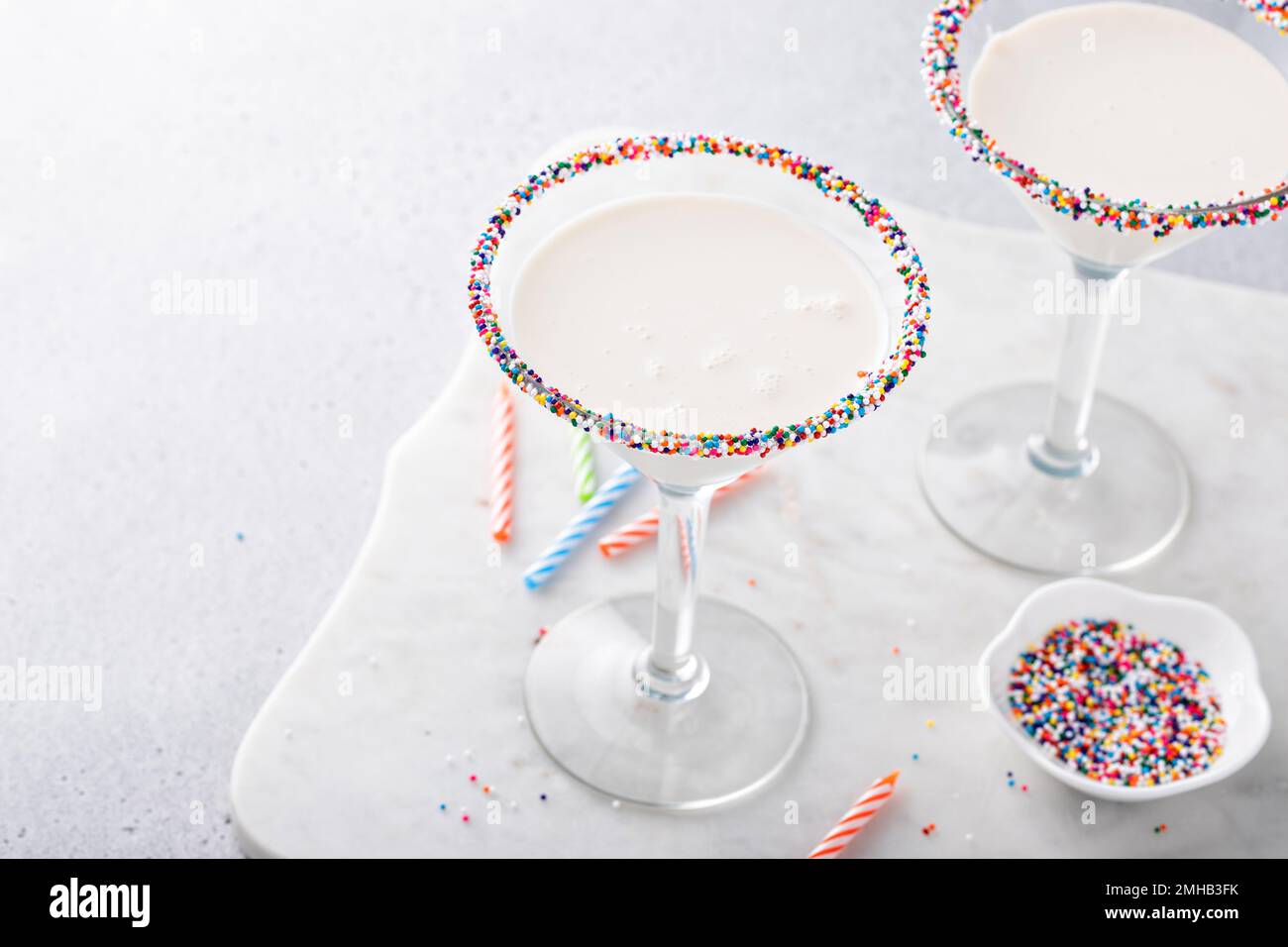 Birthday cake martini with sprinkles on rim Stock Photo - Alamy