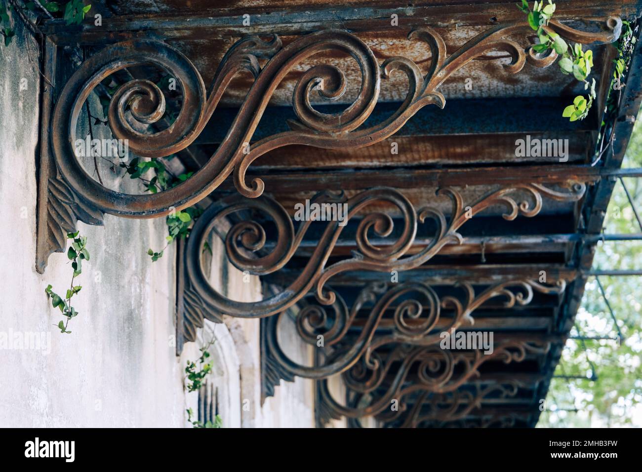Rustic decorative black iron accents holding up a balcony Stock Photo ...