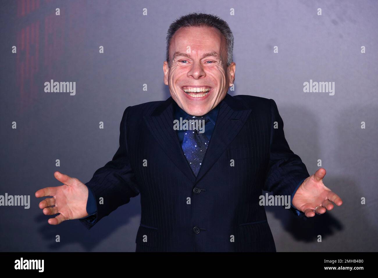Actor Warwick Davis poses for photographers upon arrival at the ...