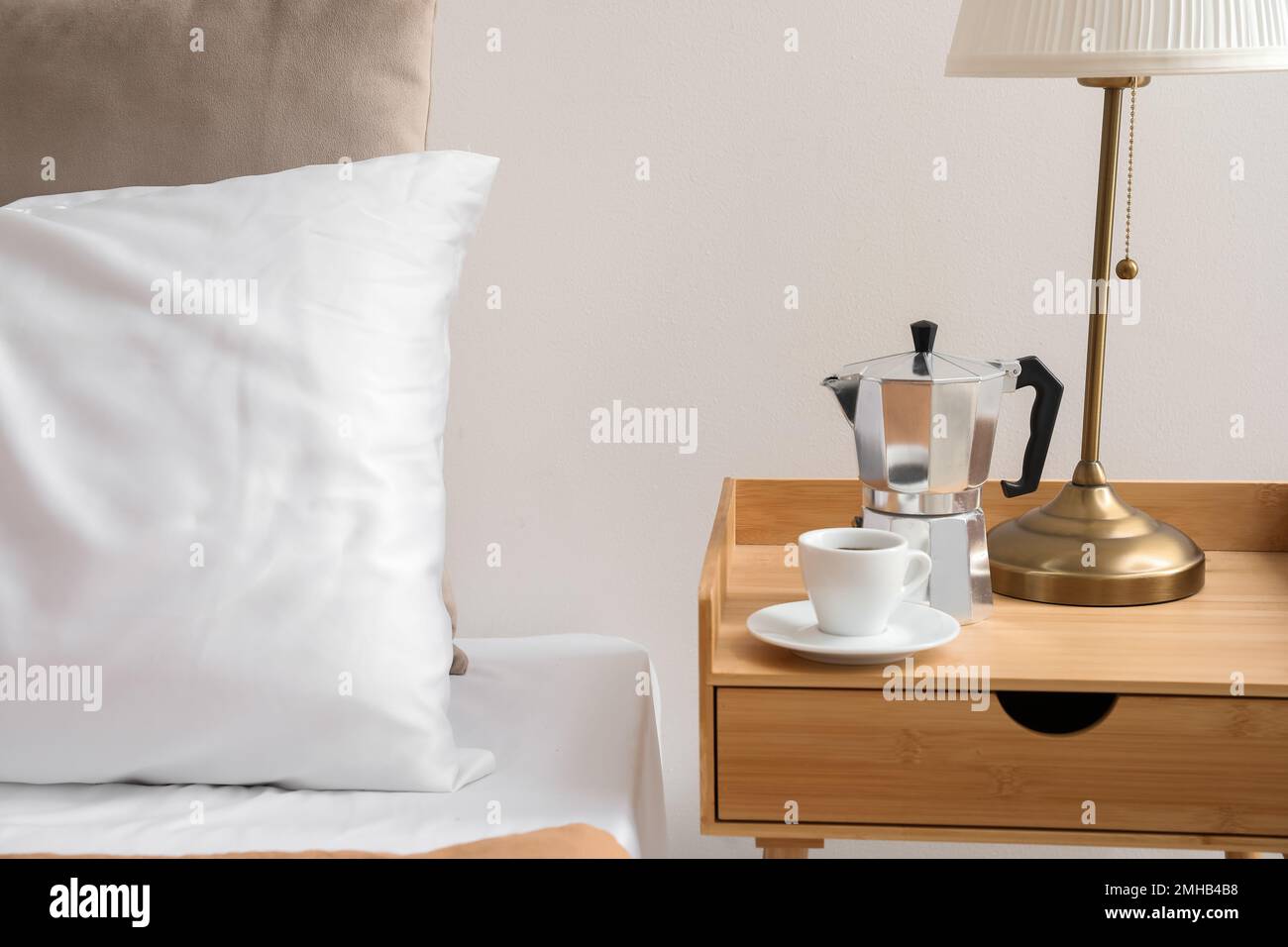 Geyser coffee maker and cup of espresso on nightstand near bed Stock ...