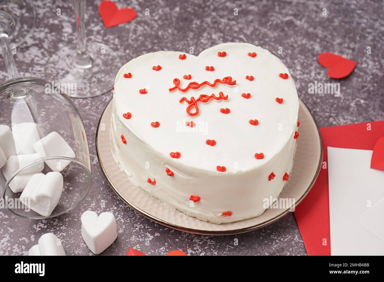 Plate with heart-shaped bento cake on grey background. Valentine's Day ...
